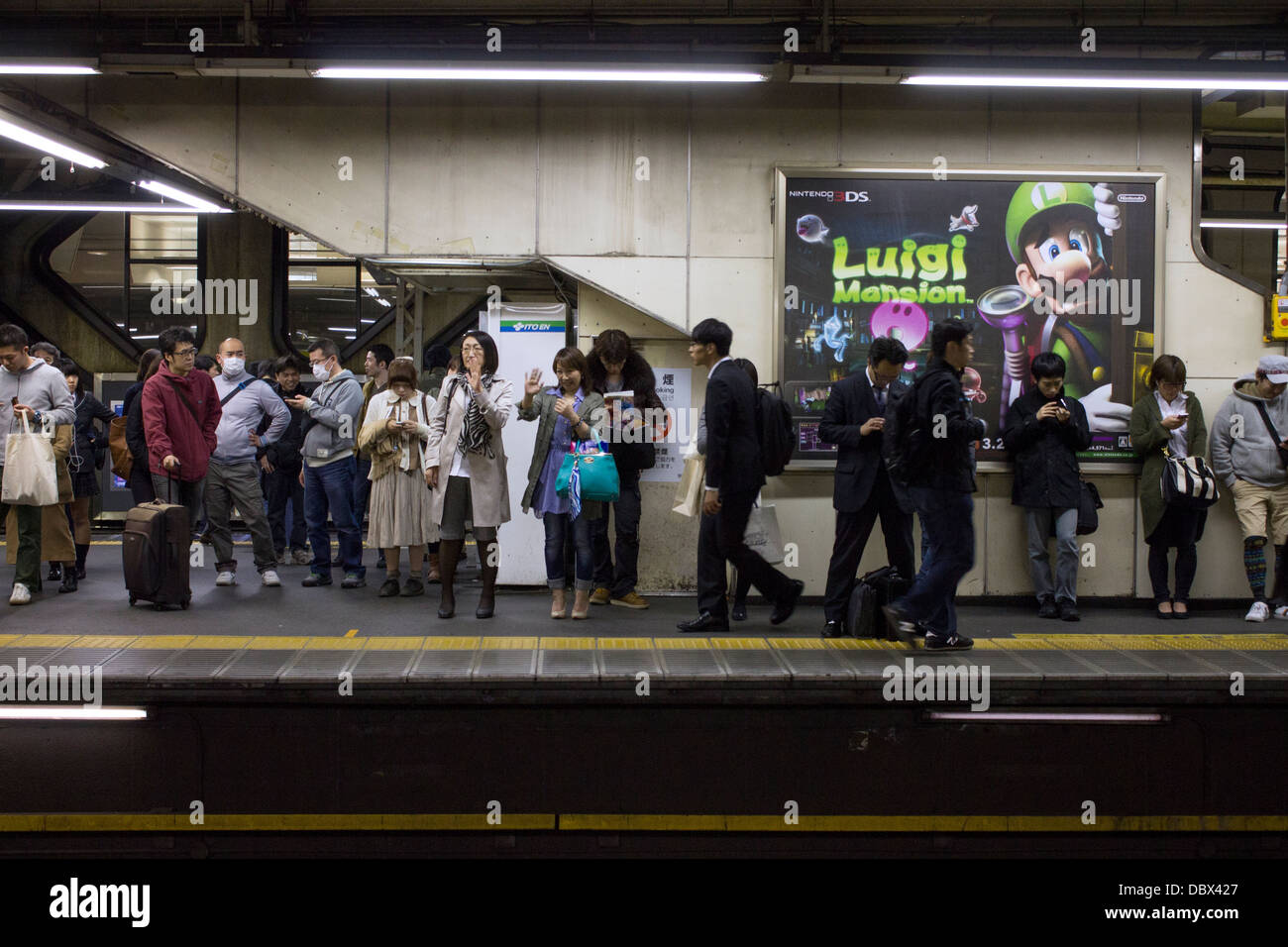 Japanese Commuters waiting on Japanese Subway Platform for Train at ...