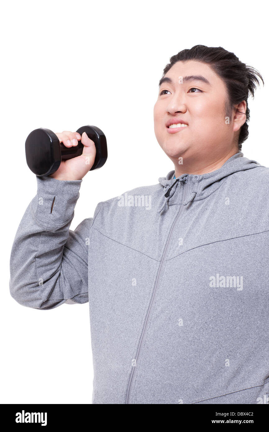 Overweight man exercising with dumbbell Stock Photo - Alamy