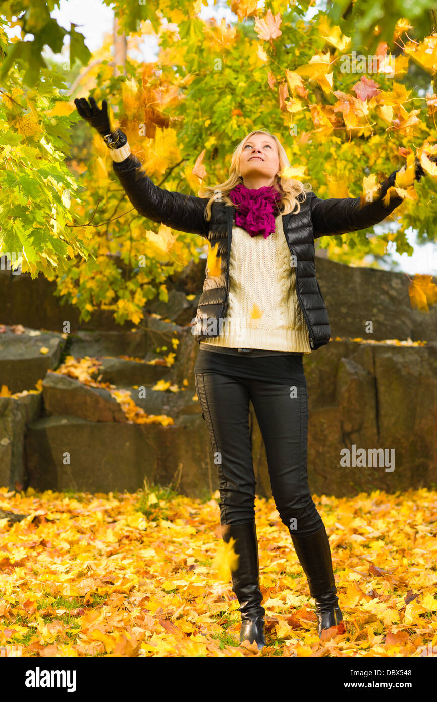 Beautiful girl falling leaves colors hi-res stock photography and ...
