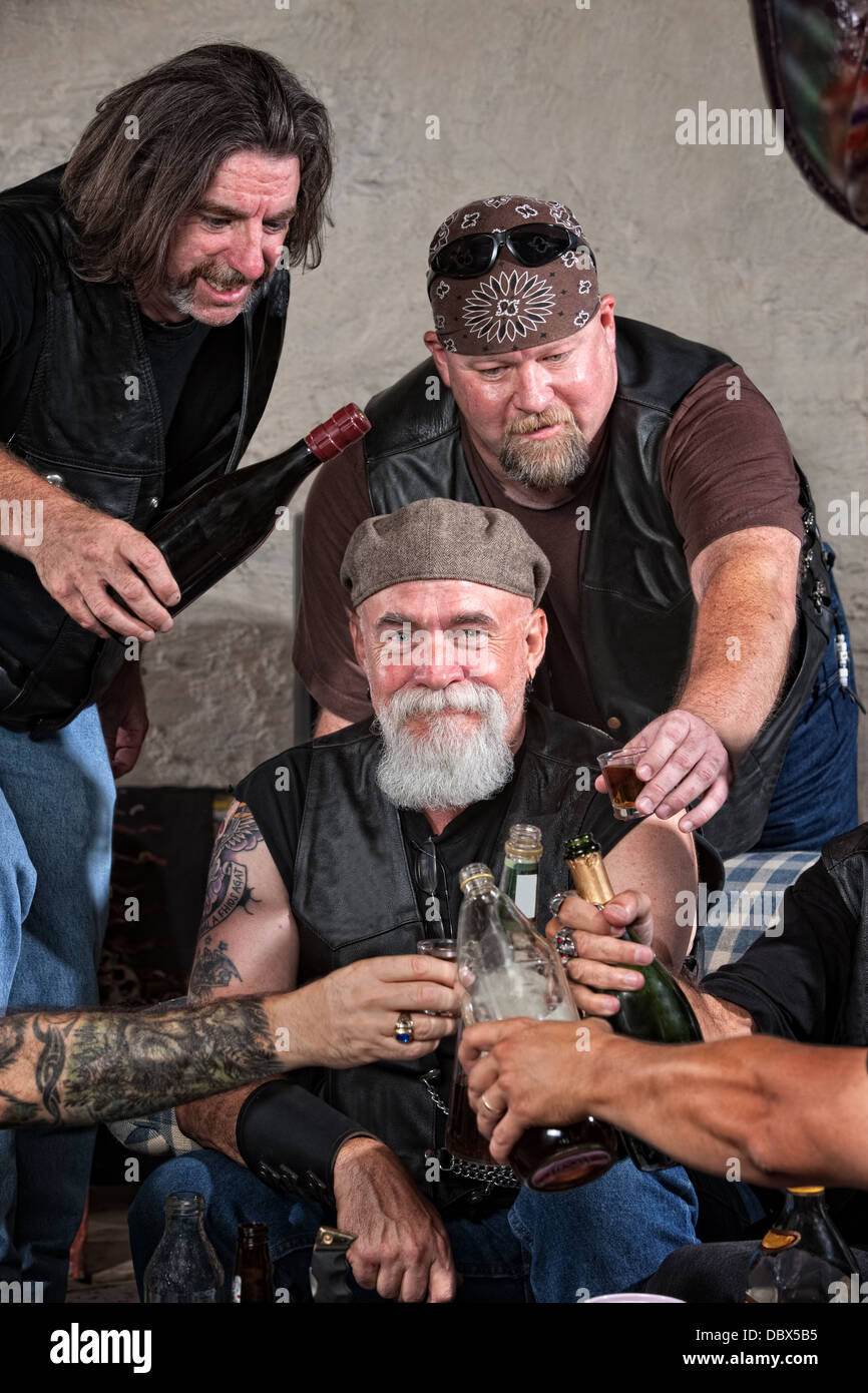 Happy Gang Members with Alcohol Stock Photo - Alamy
