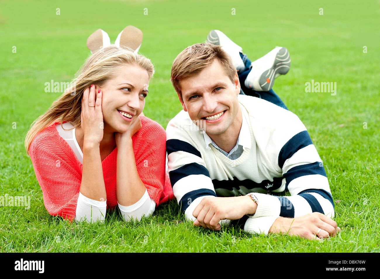 Romantic young couple outdoors in the park Stock Photo - Alamy