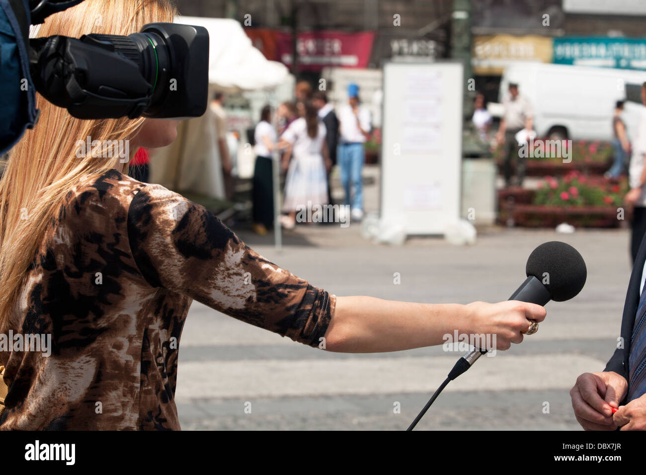 journalist hand holding a microphone conducting an TV or radio ...