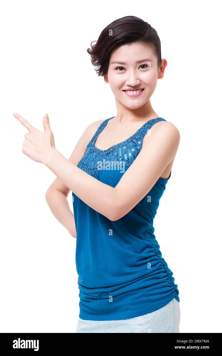 Cheerful young woman pointing Stock Photo - Alamy