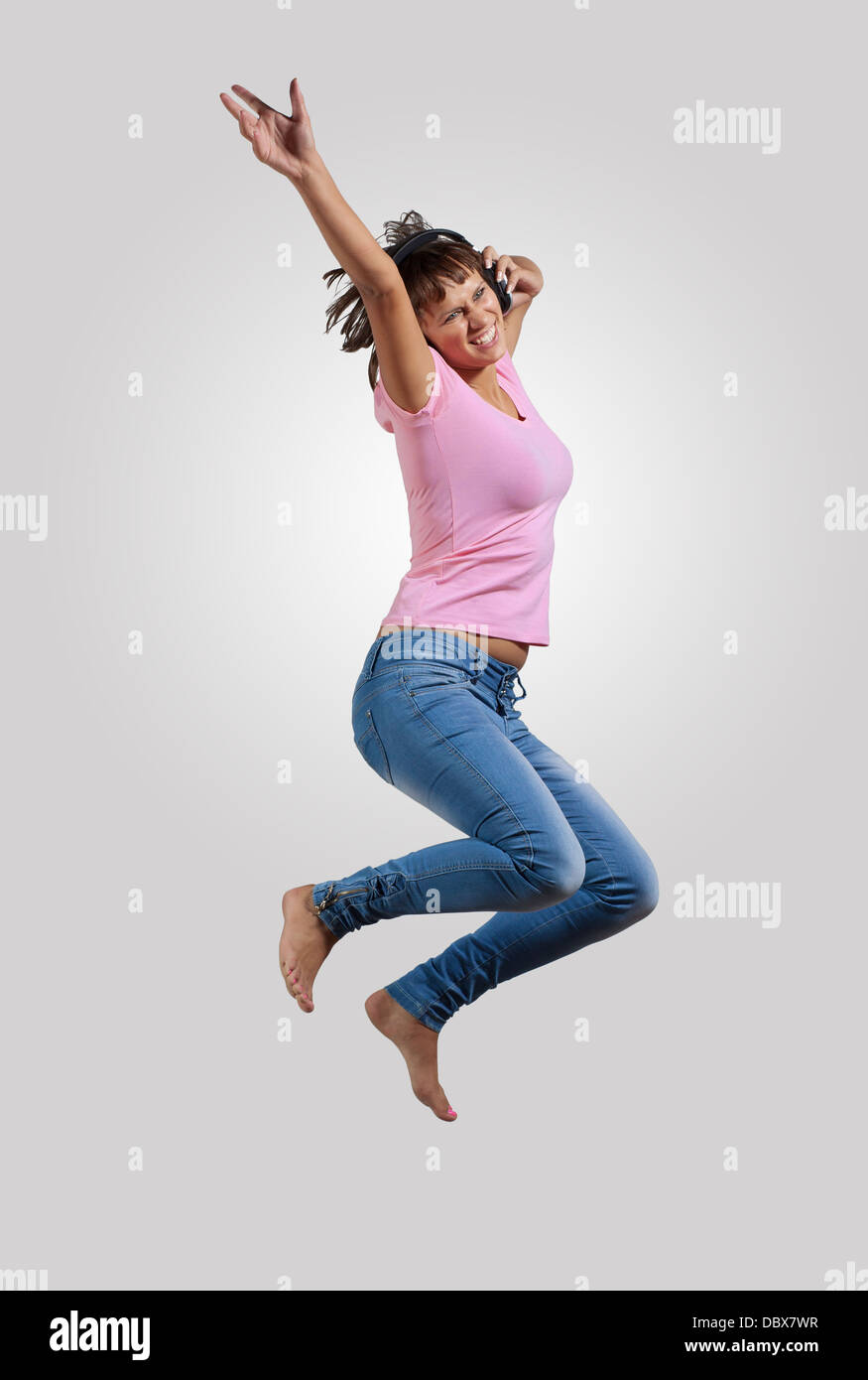 young woman dancing and jumping Stock Photo - Alamy