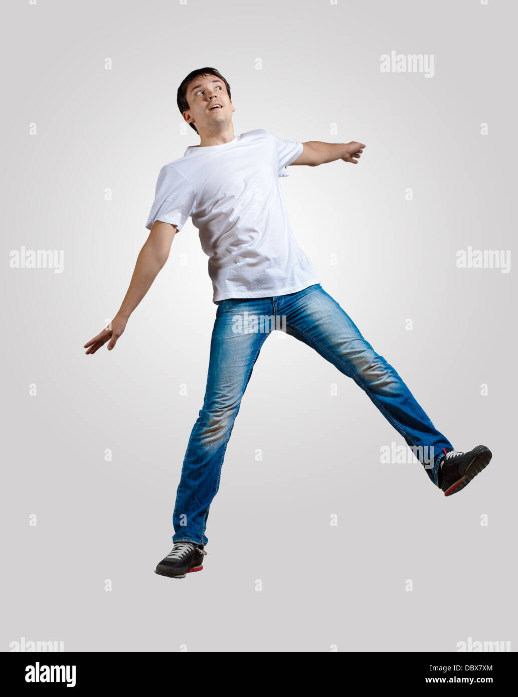 Young man dancing and jumping Stock Photo - Alamy
