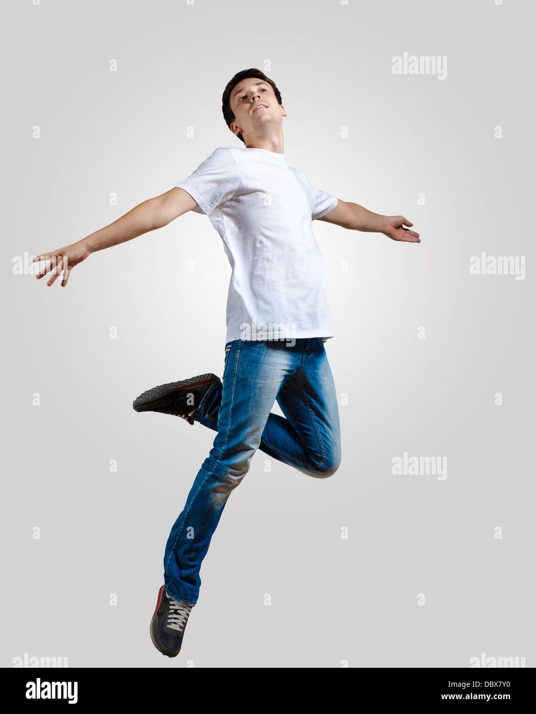 Young man dancing and jumping Stock Photo - Alamy