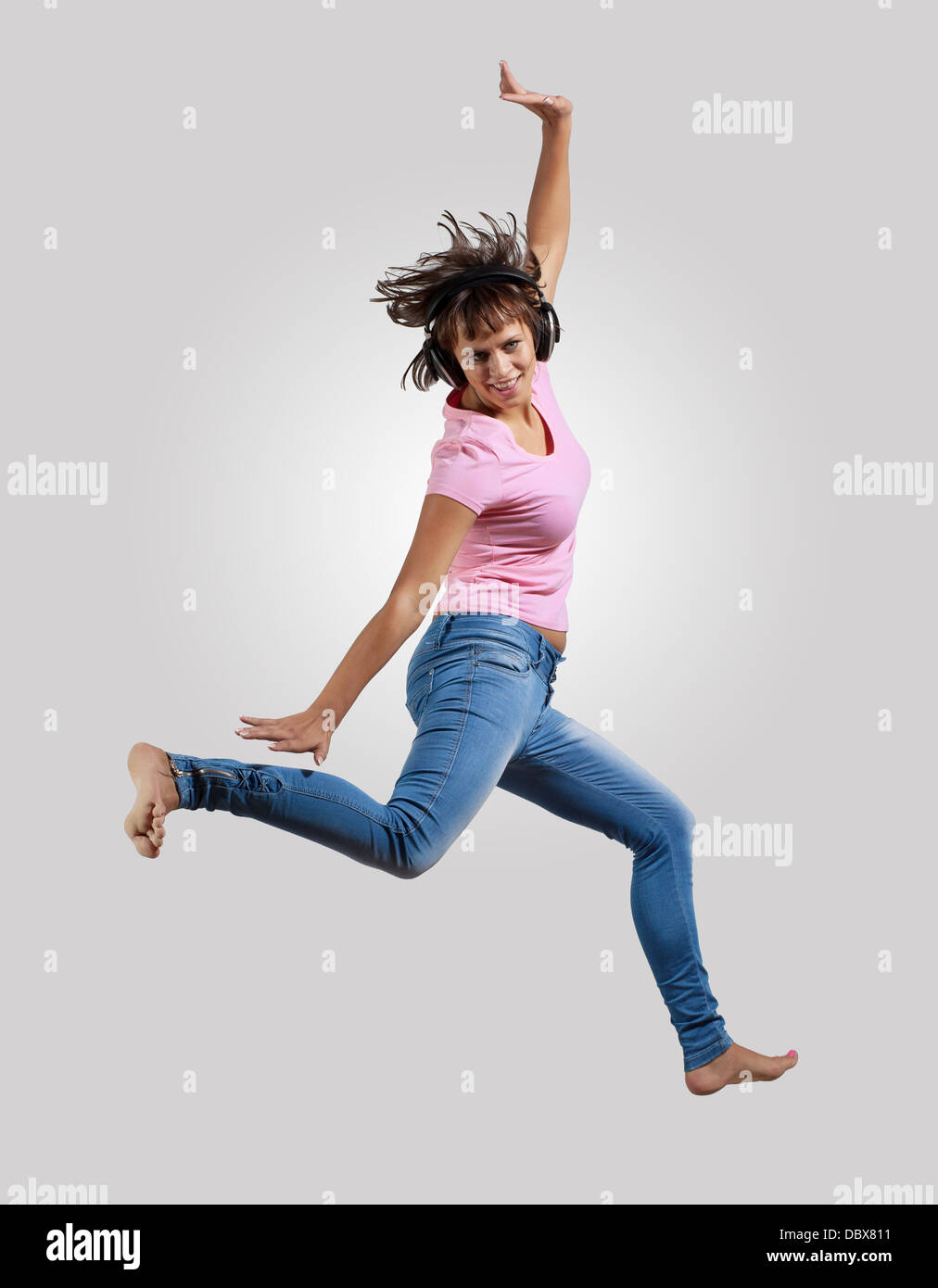 young woman dancing and jumping Stock Photo - Alamy
