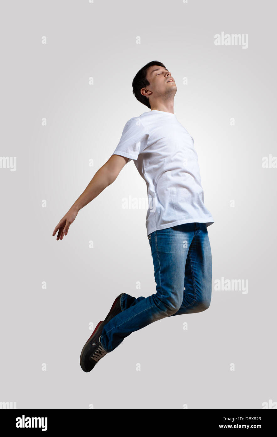 Young man dancing and jumping Stock Photo - Alamy
