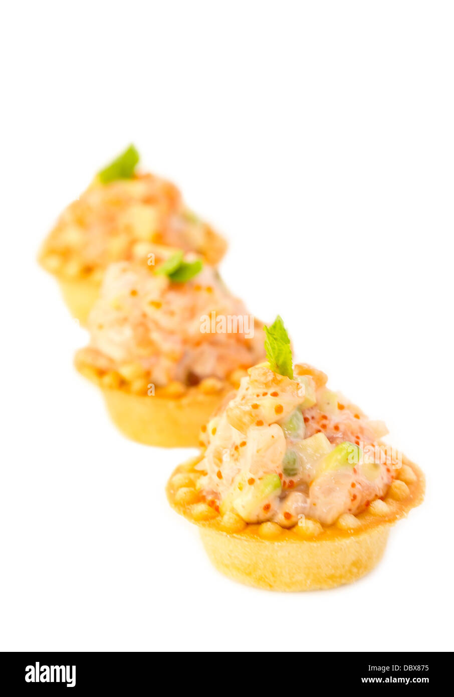canape with meat seafood and vegetables on a white background Stock ...