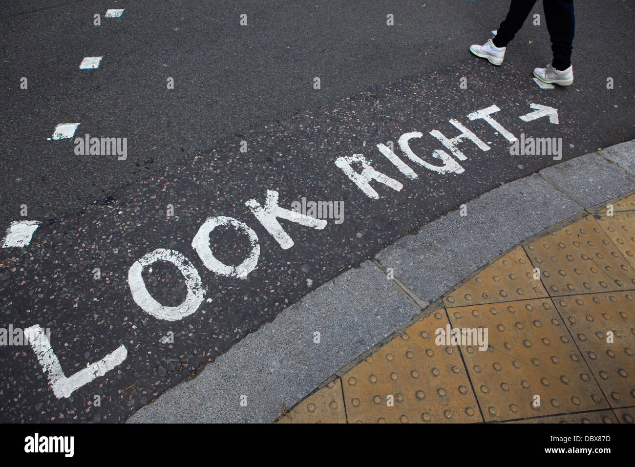 Crosswalks with "look right" warning, London, UK Stock Photo - Alamy