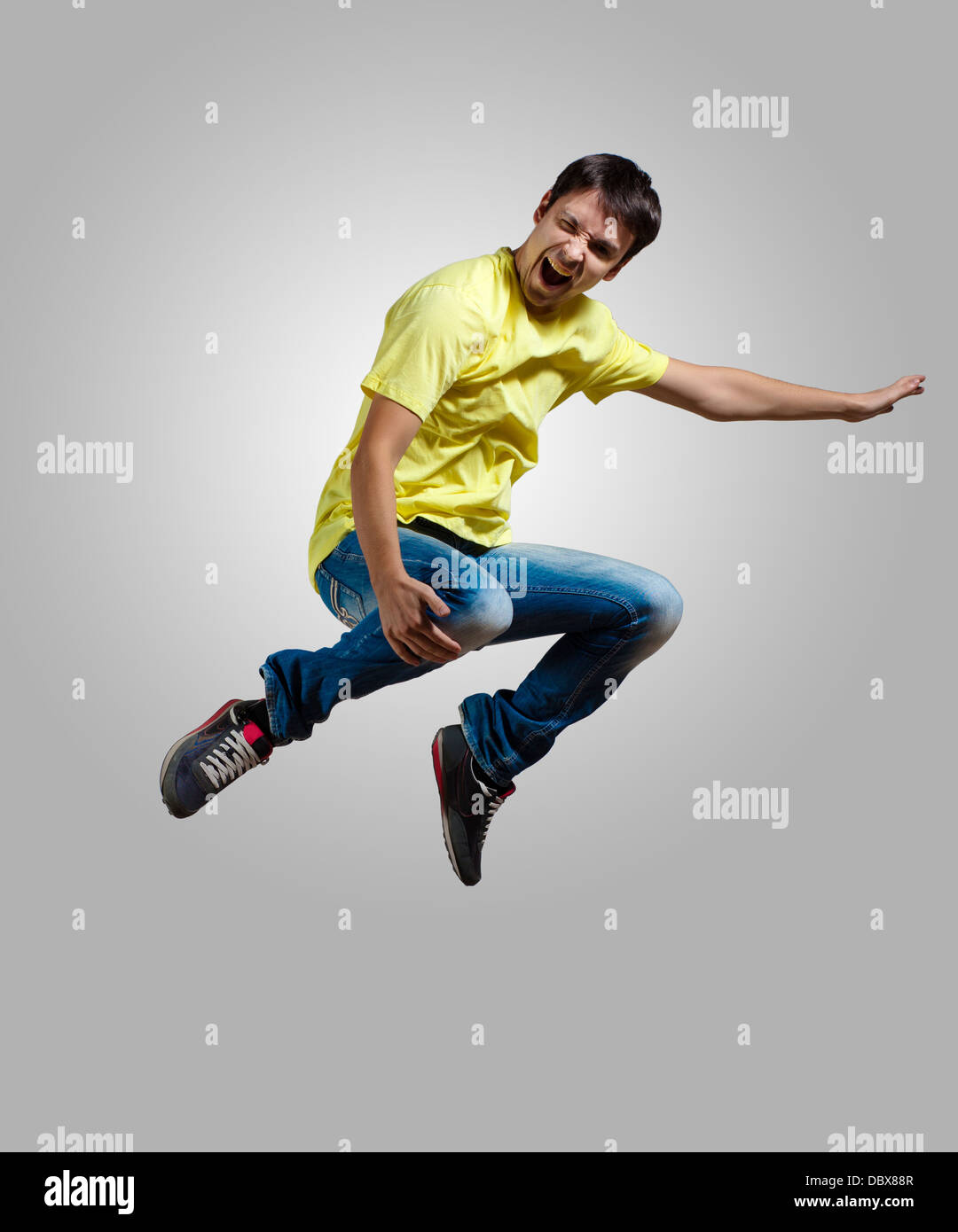 Young man dancing and jumping Stock Photo - Alamy