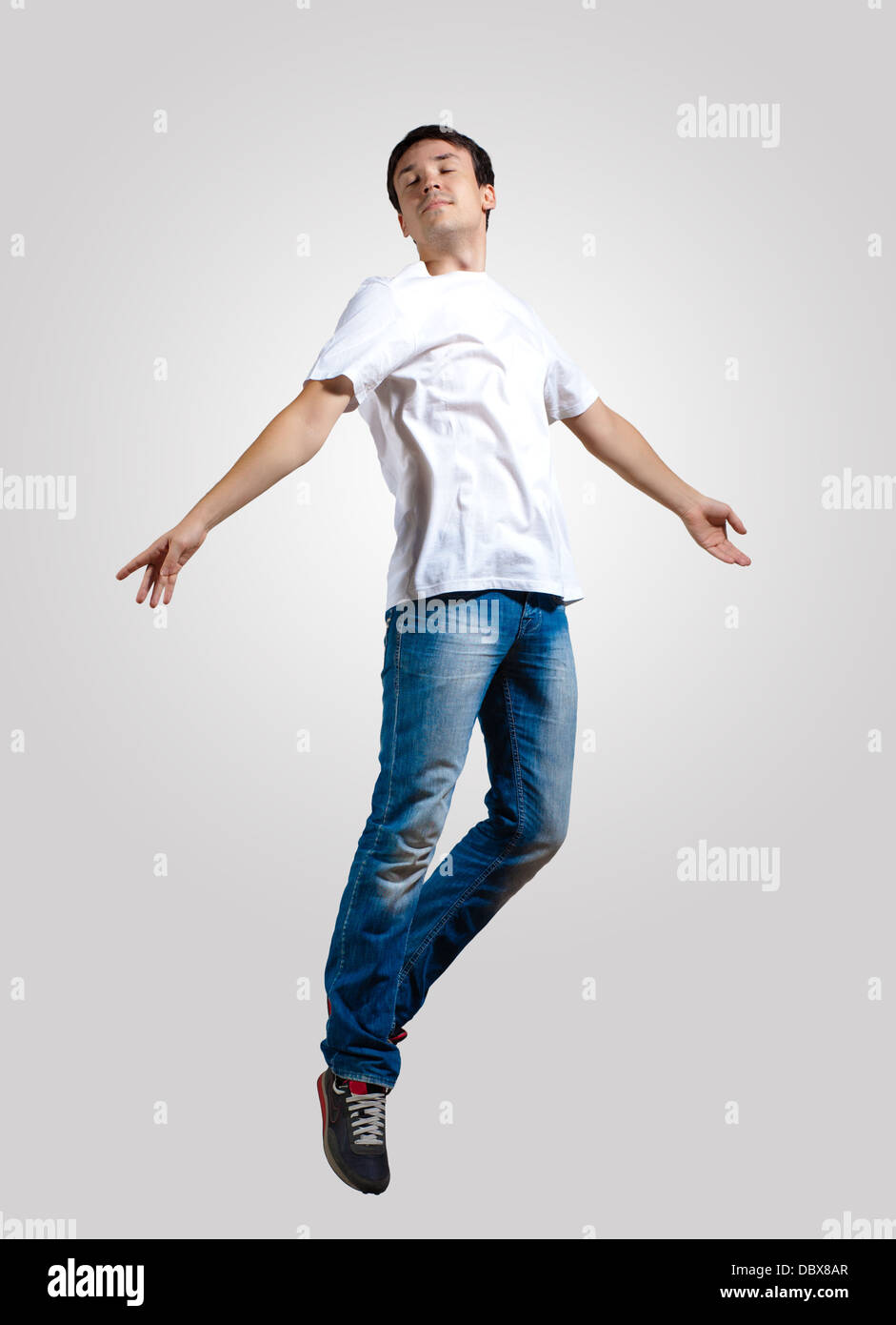 Young man dancing and jumping Stock Photo - Alamy