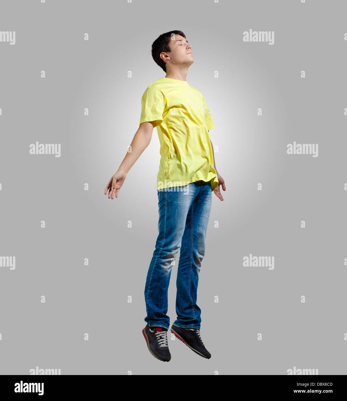 Young man dancing and jumping Stock Photo - Alamy