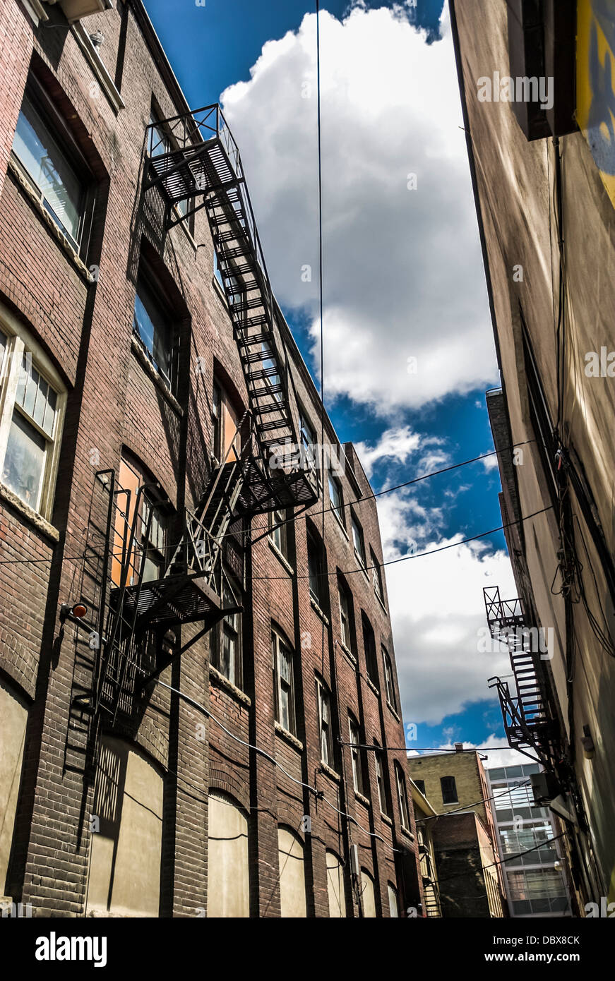 Typical city back alley with fire escape Stock Photo - Alamy