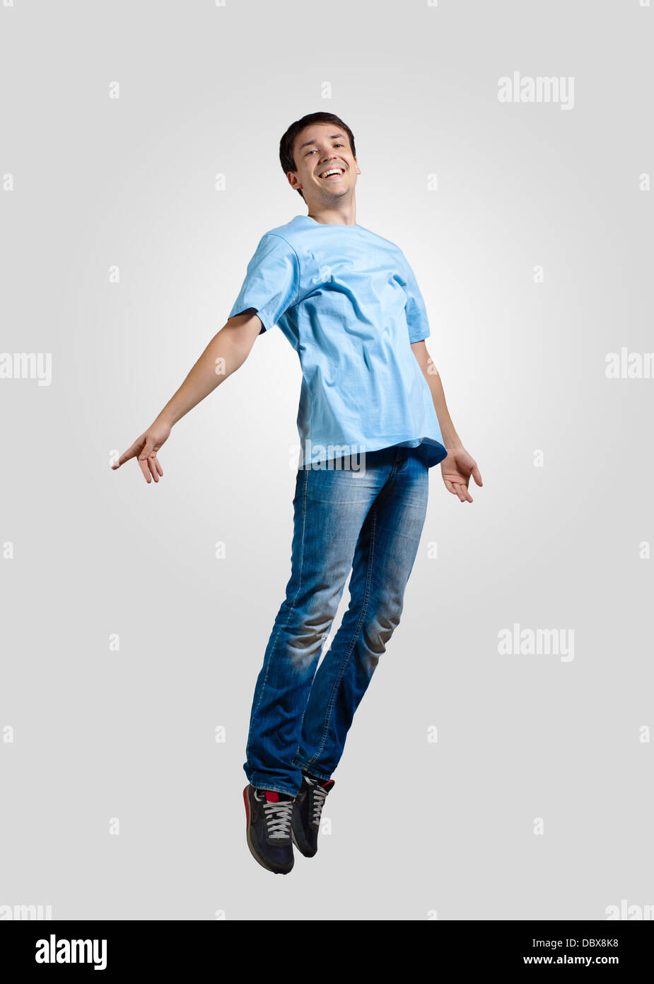 Young man dancing and jumping Stock Photo - Alamy