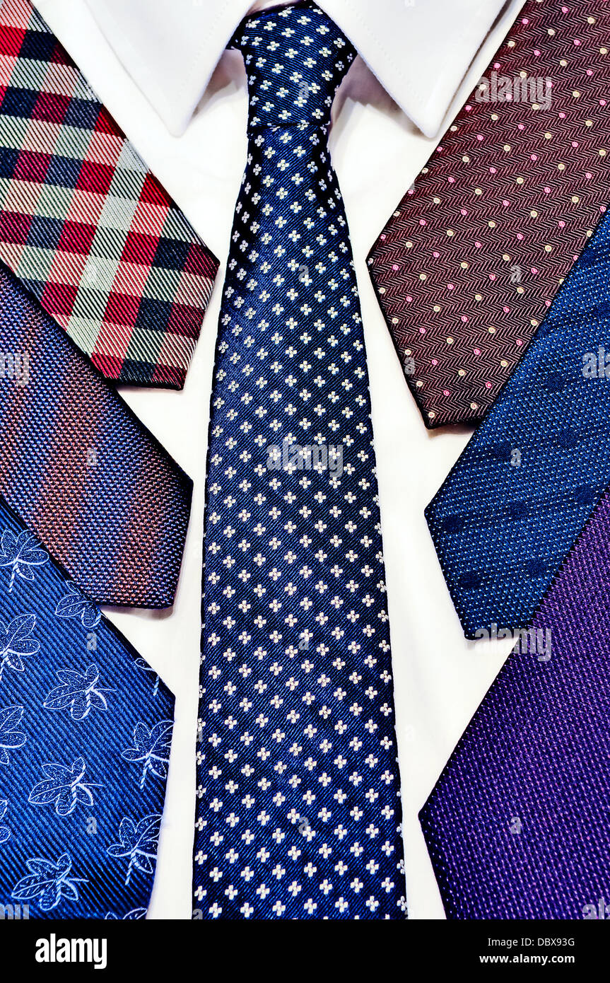 Stack of neck ties on white shirt Stock Photo - Alamy