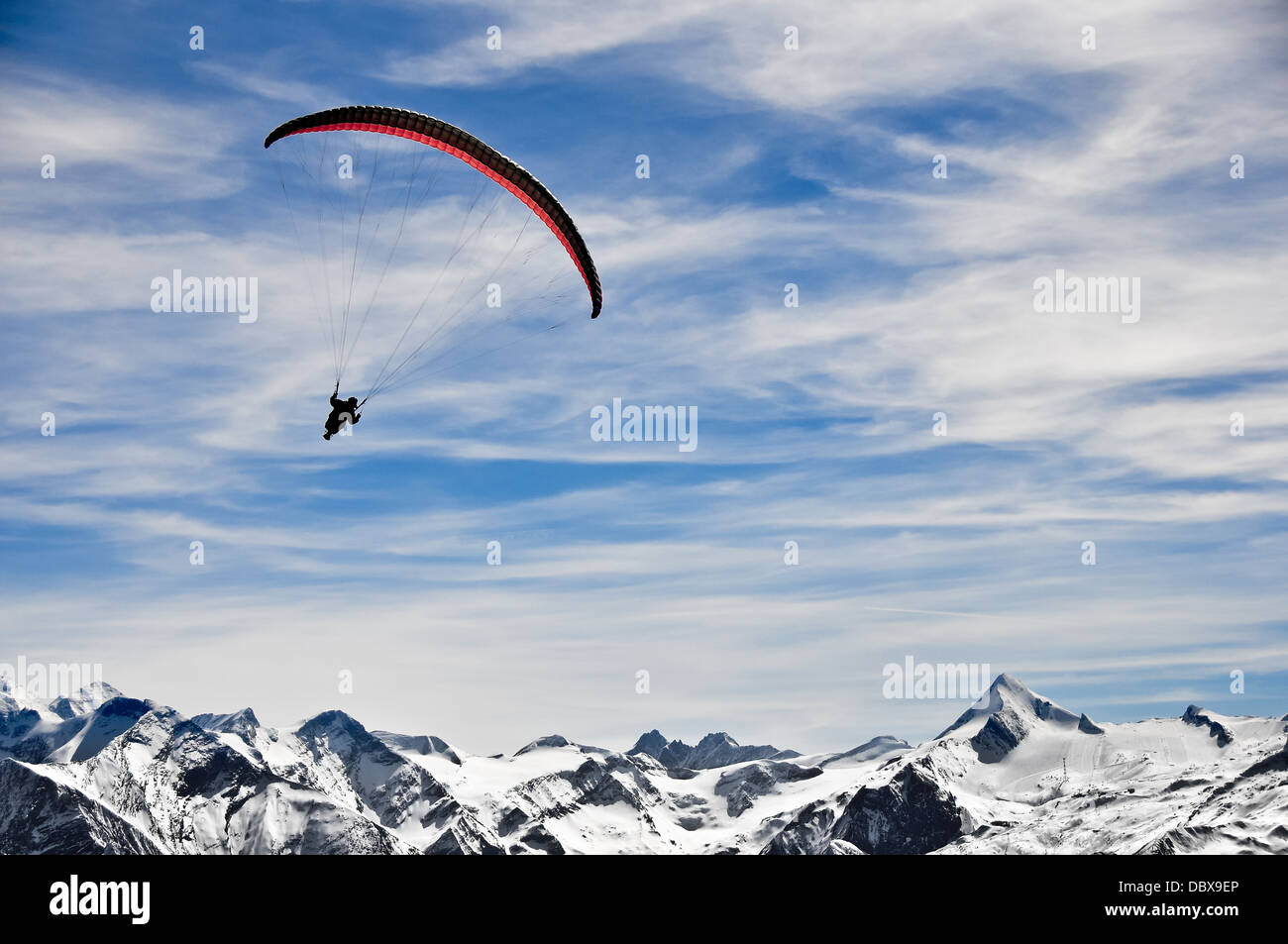 Winter mountains and paragliding with mountains background Stock Photo ...