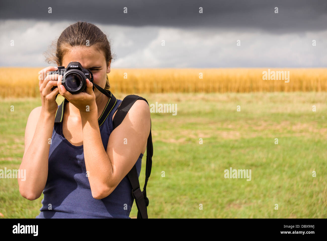Female Photographer With Camera Nikon