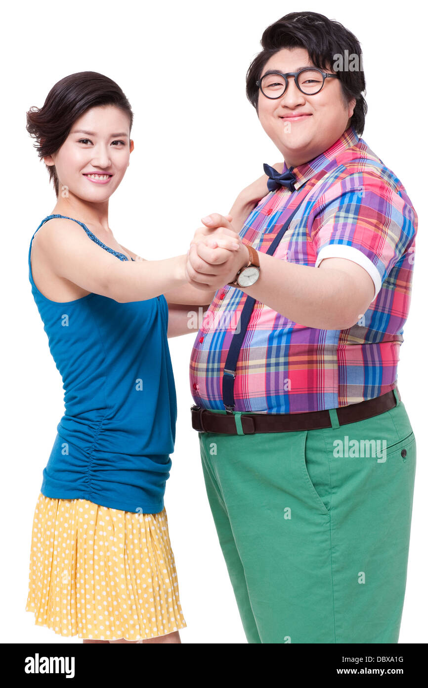 Overweight man dancing with girlfriend Stock Photo - Alamy