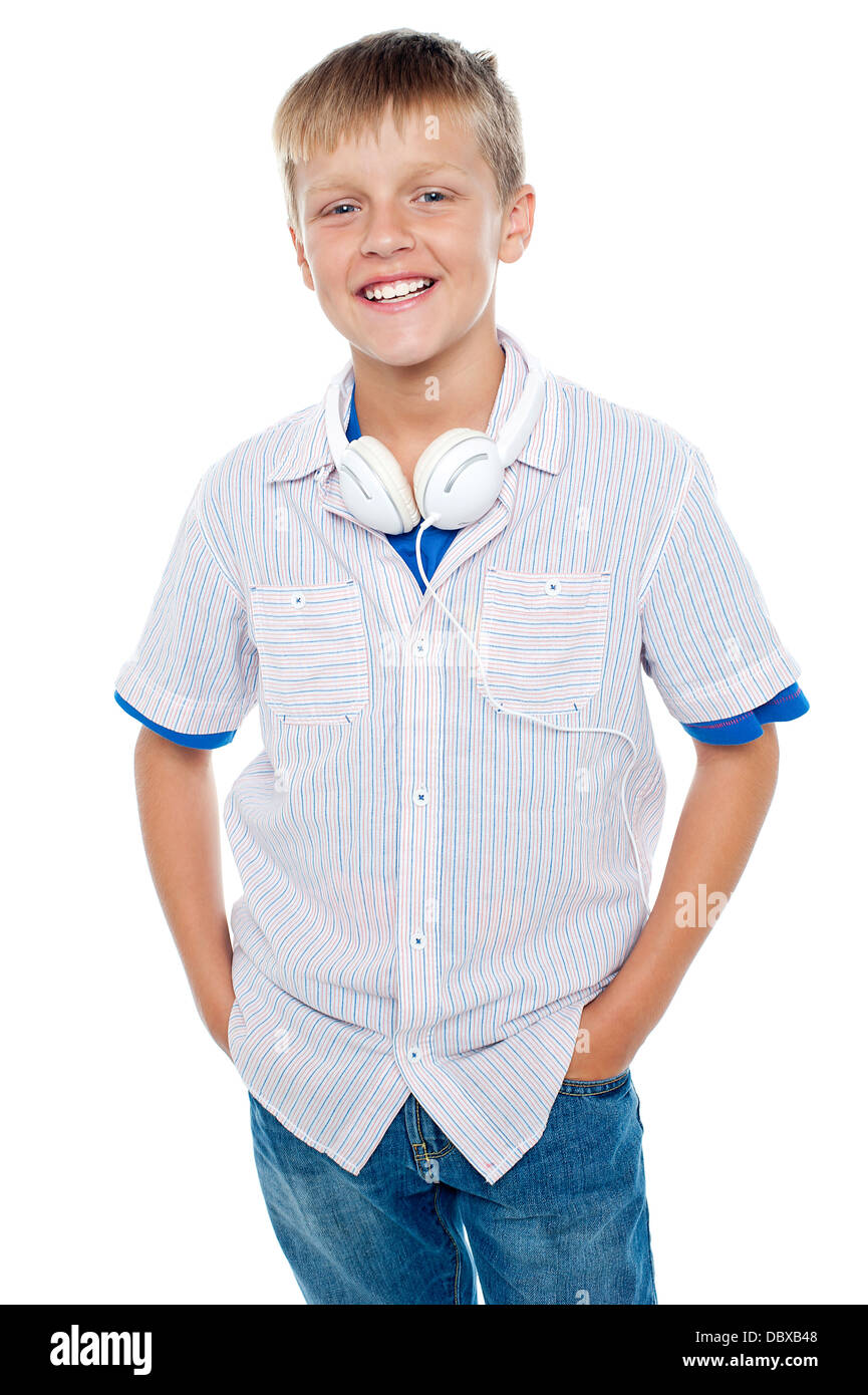 Fashionable kid posing with headphones around his neck Stock Photo - Alamy