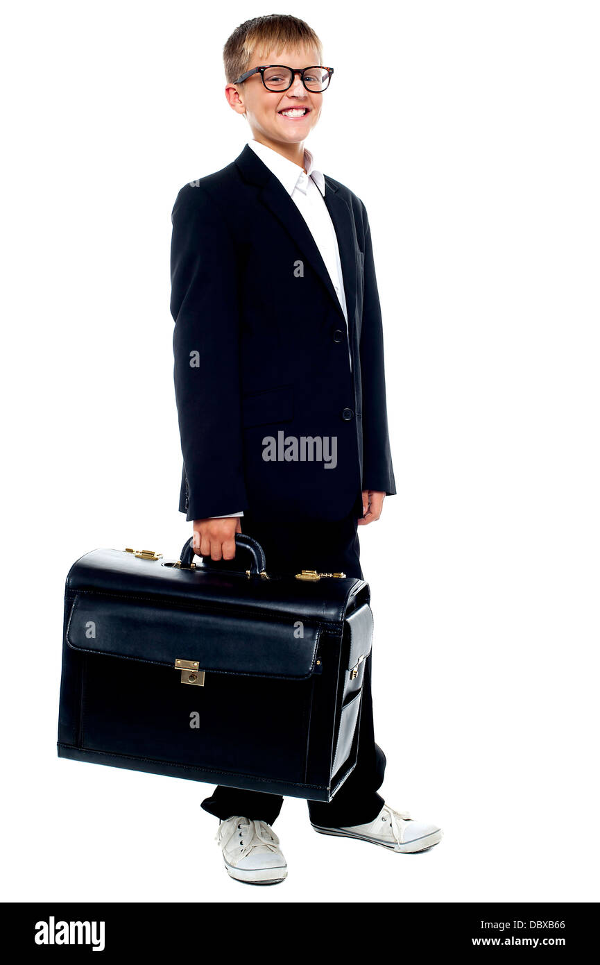 Full length portrait of cute boy carrying a briefcase Stock Photo - Alamy