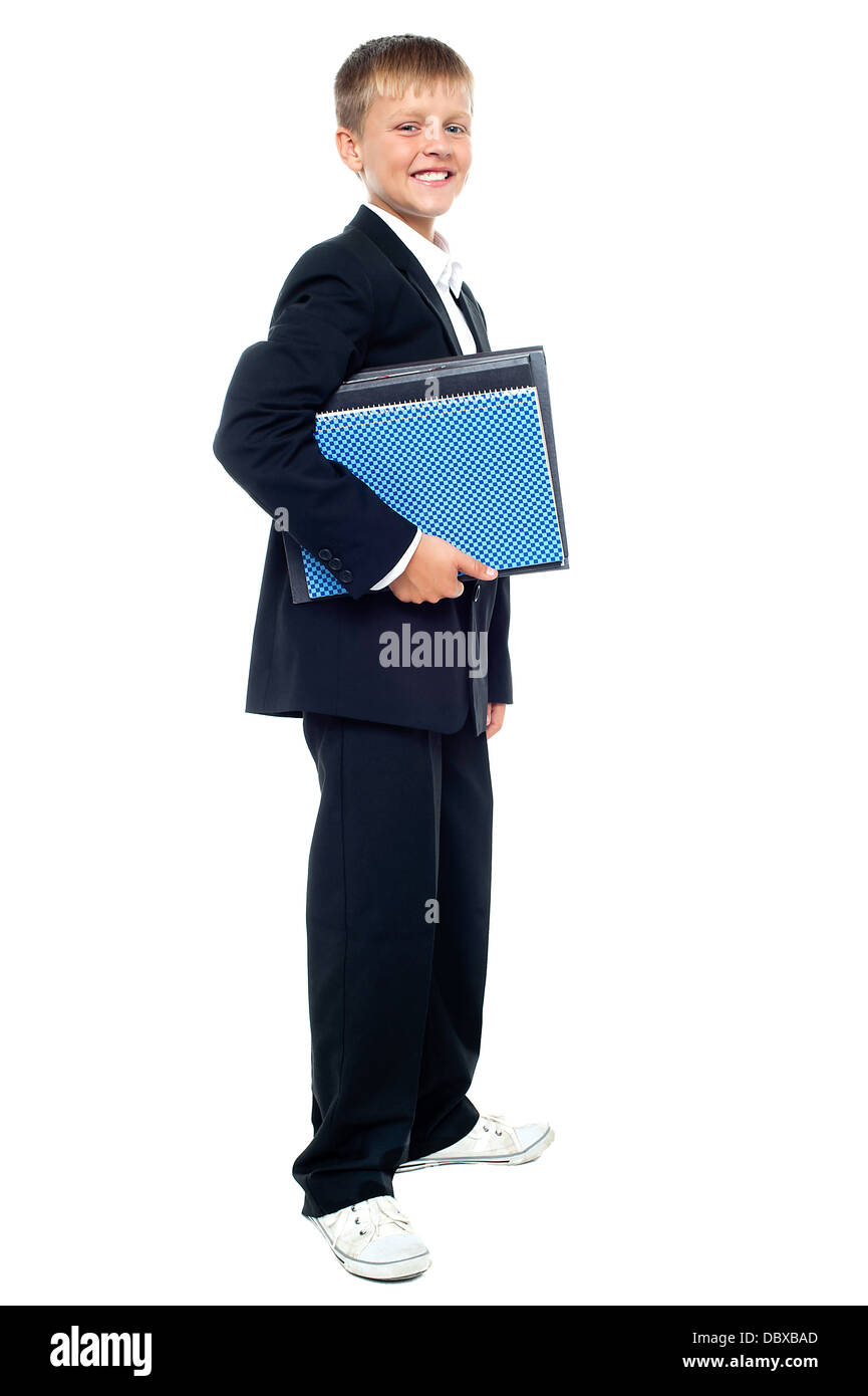 Smiling kid holding files, young business boy Stock Photo - Alamy