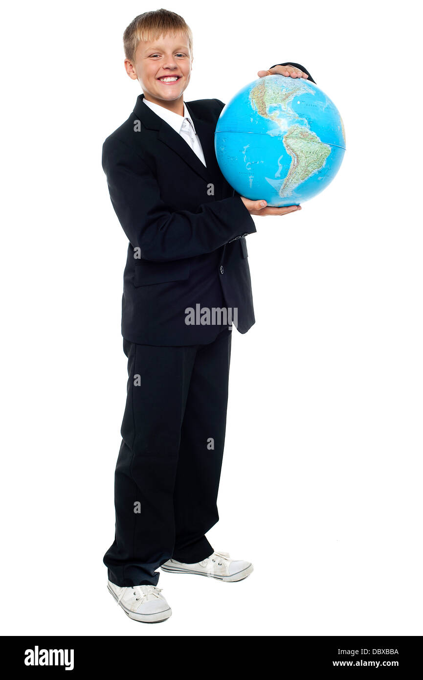 Smart looking young kid holding globe Stock Photo - Alamy