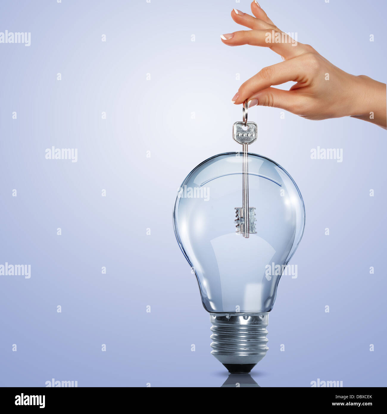 Key inside a light bulb Stock Photo - Alamy