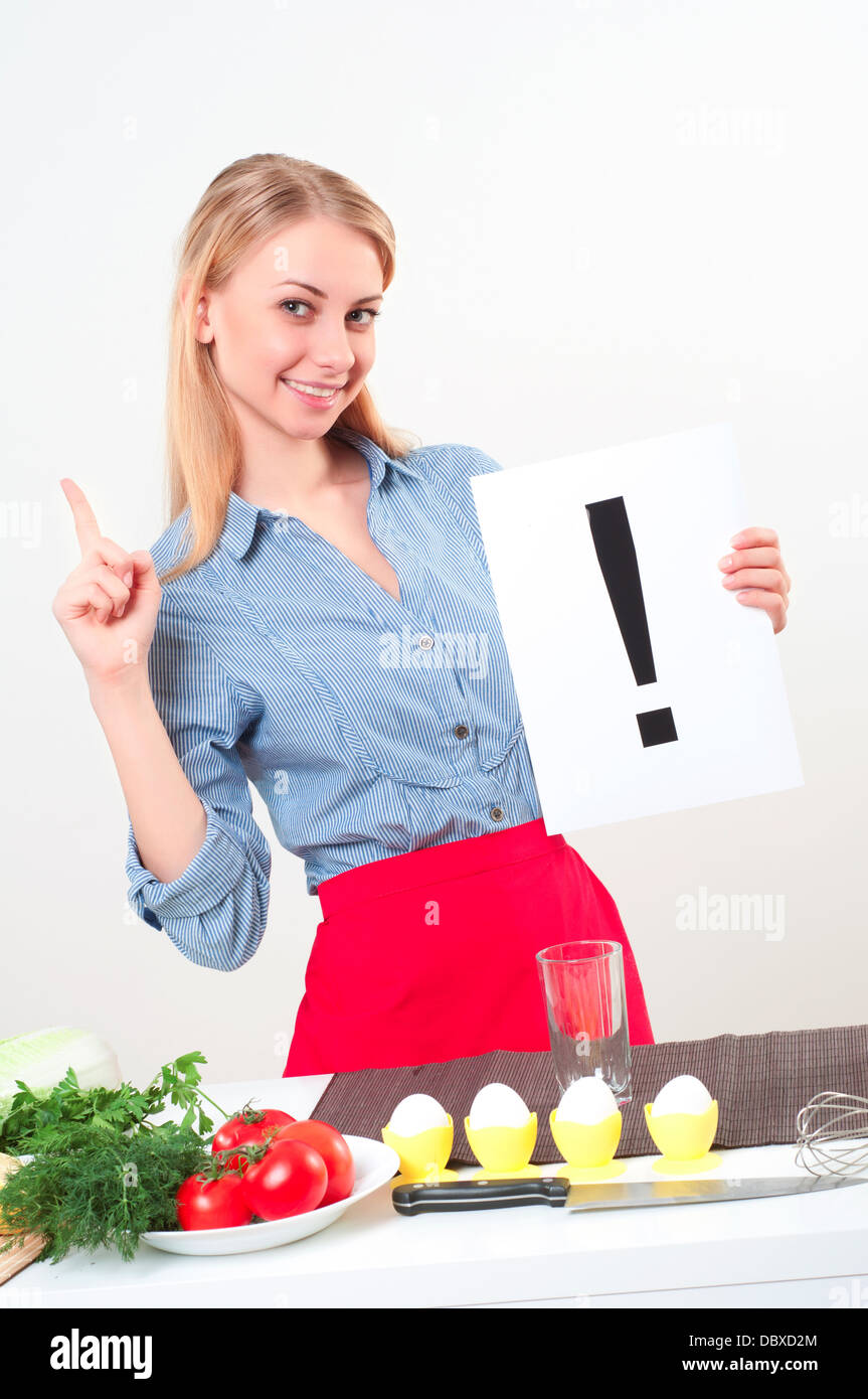 portrait of a young woman, hold exclamation mark Stock Photo - Alamy