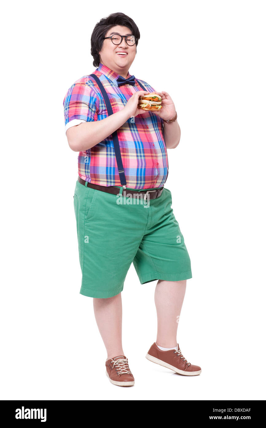 Happy overweight man with burger Stock Photo - Alamy