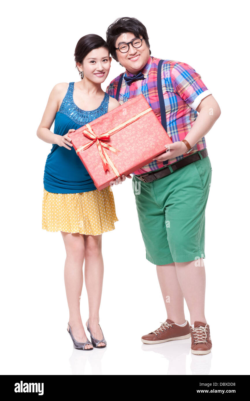 Happy fat man and girlfriend with gift Stock Photo - Alamy
