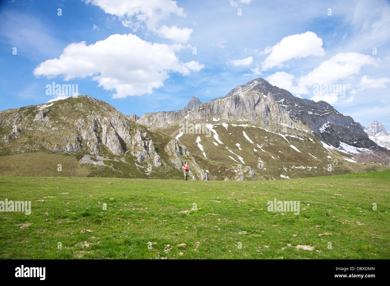 great rock mountain and far woman Stock Photo - Alamy
