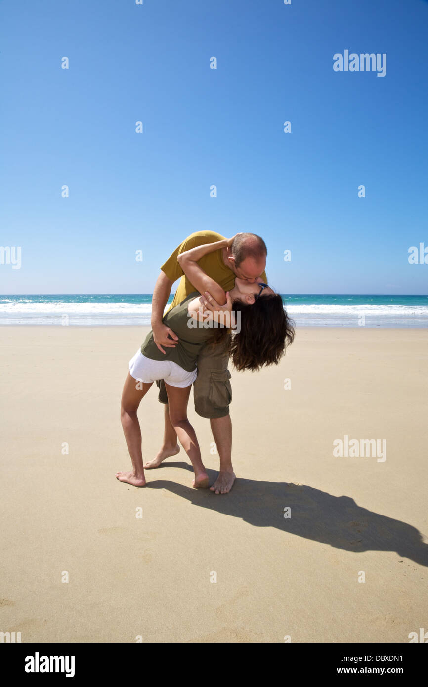 kissing couple at beach Stock Photo - Alamy