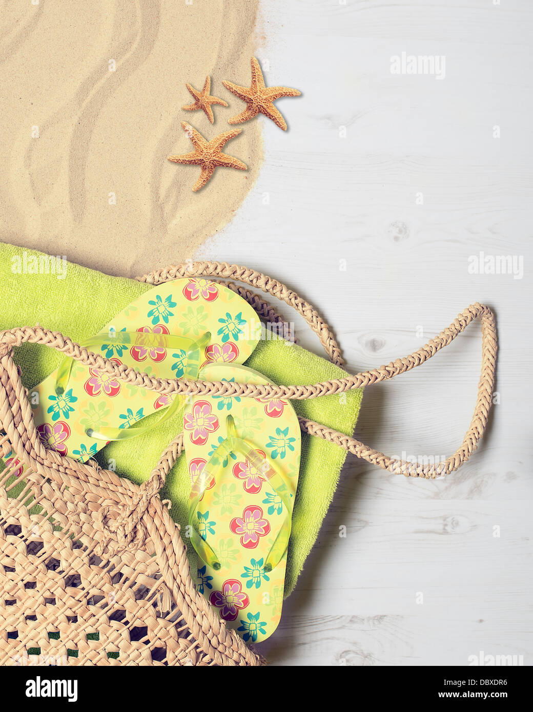 Beach basket with flip flops on wooden decking with sand Stock Photo ...