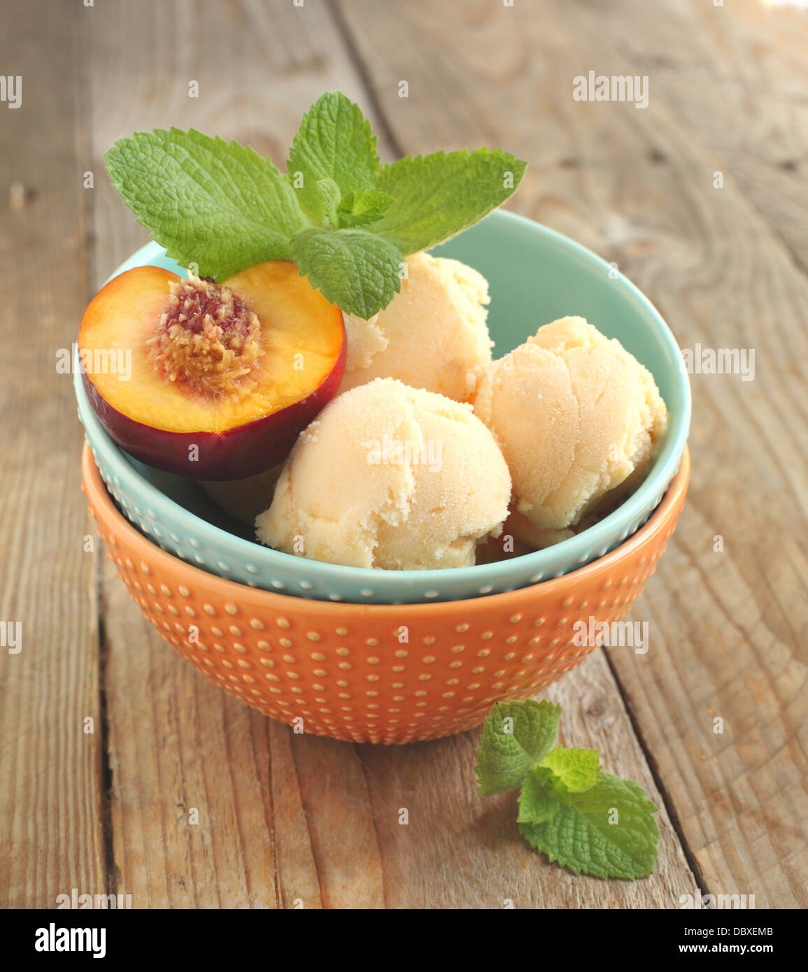 Peach ice cream in bowl Stock Photo - Alamy