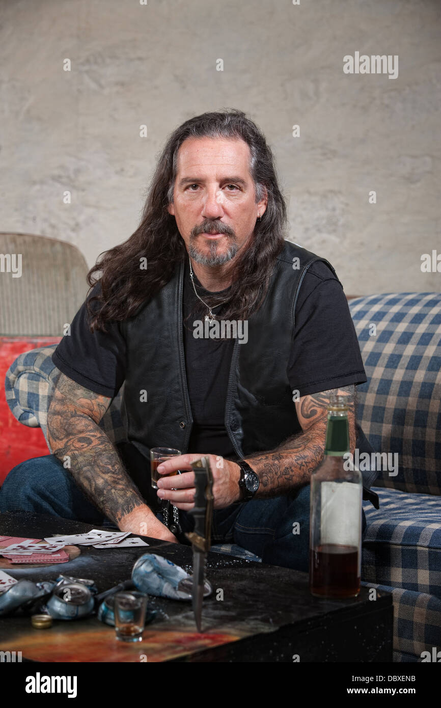 Biker Gang Member with Weapons and Alcohol Stock Photo - Alamy