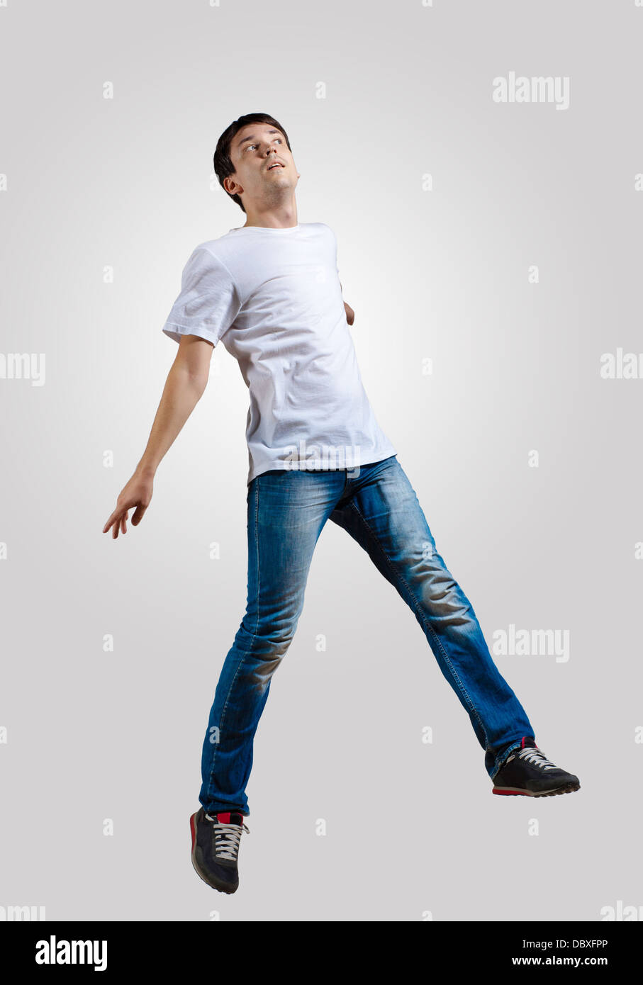 Young man dancing and jumping Stock Photo - Alamy