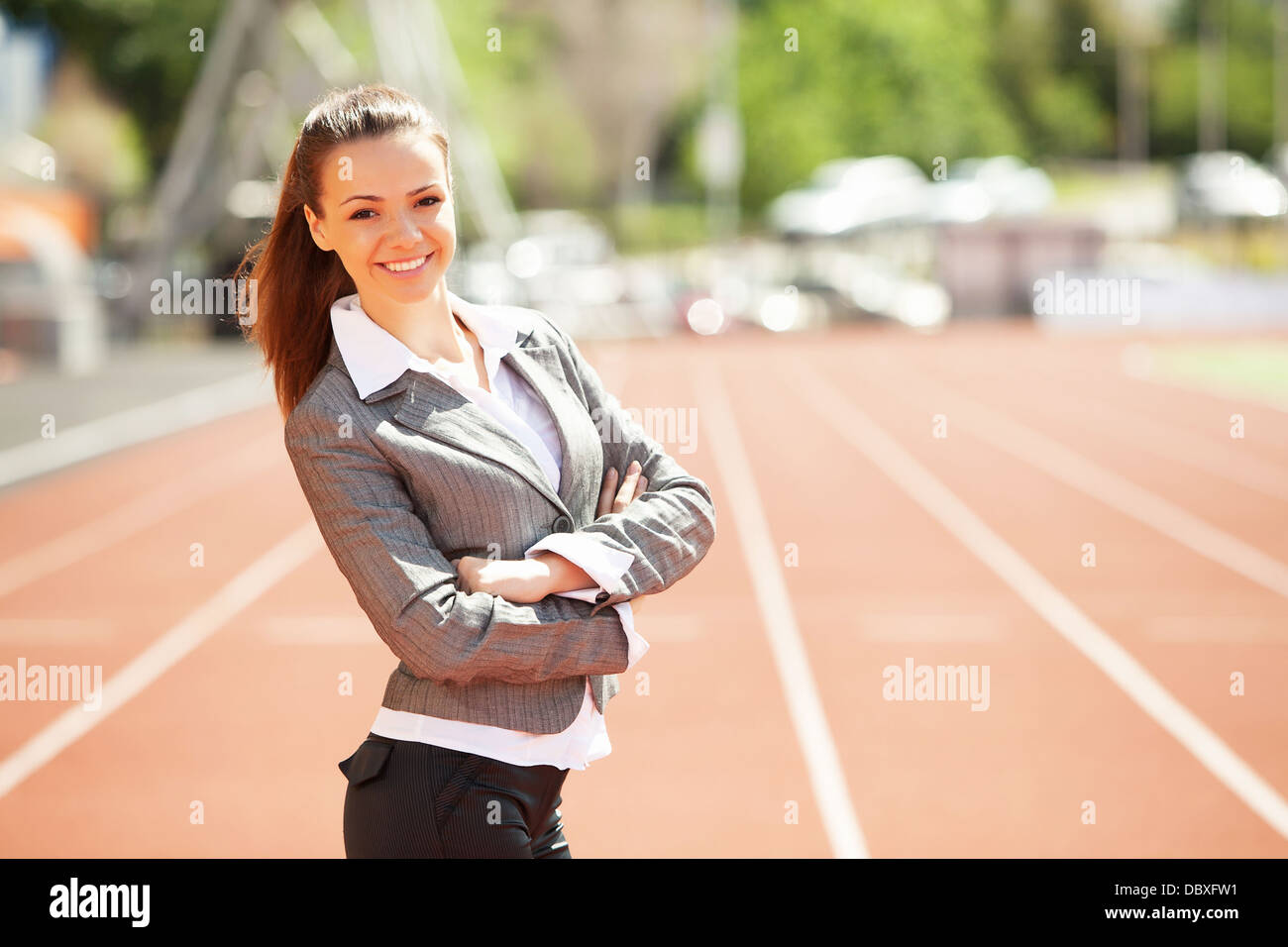 Business woman at athletic stadium Stock Photo - Alamy