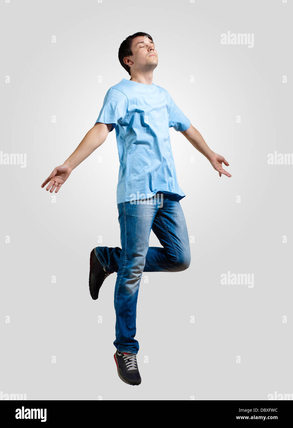 Young man dancing and jumping Stock Photo - Alamy