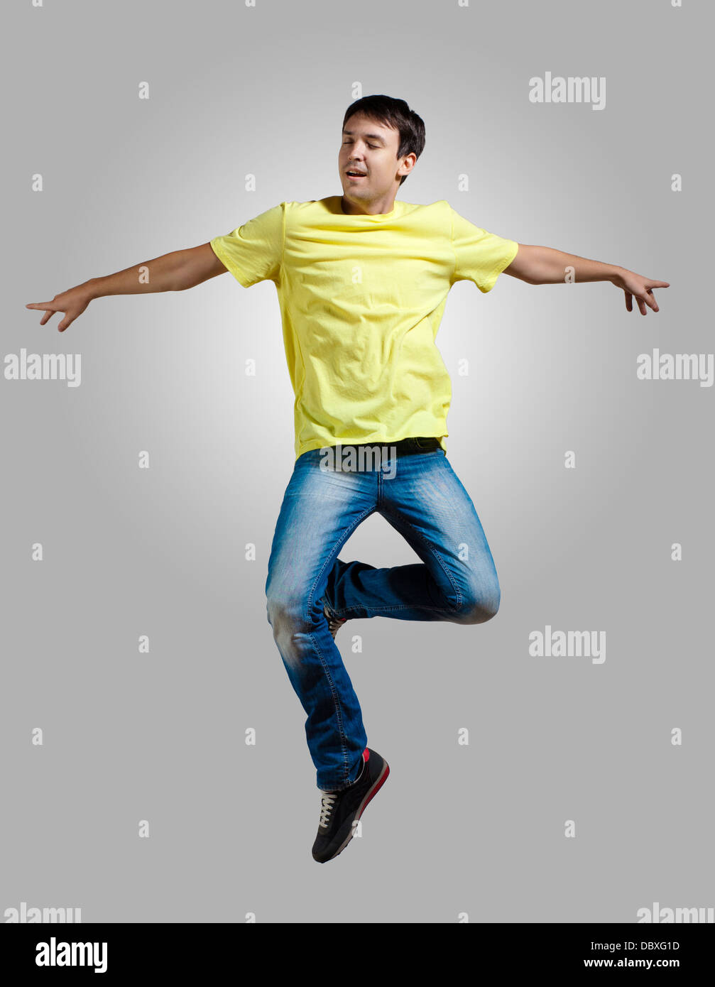 Young man dancing and jumping Stock Photo - Alamy