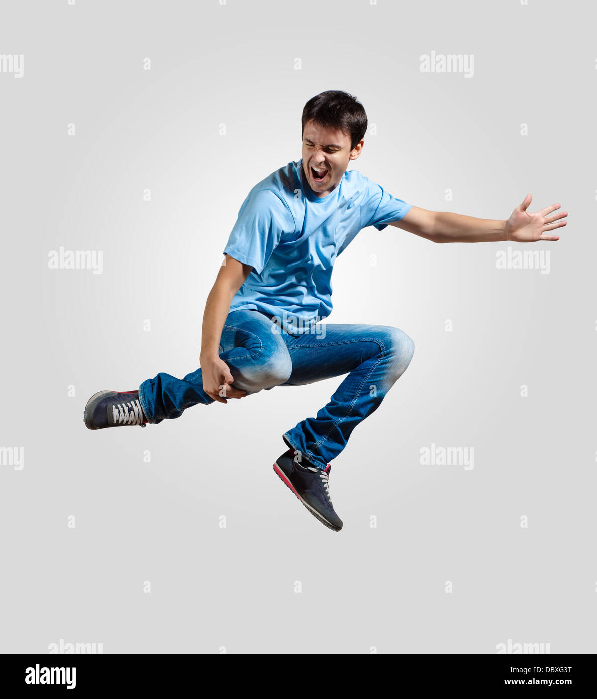 Young man dancing and jumping Stock Photo - Alamy