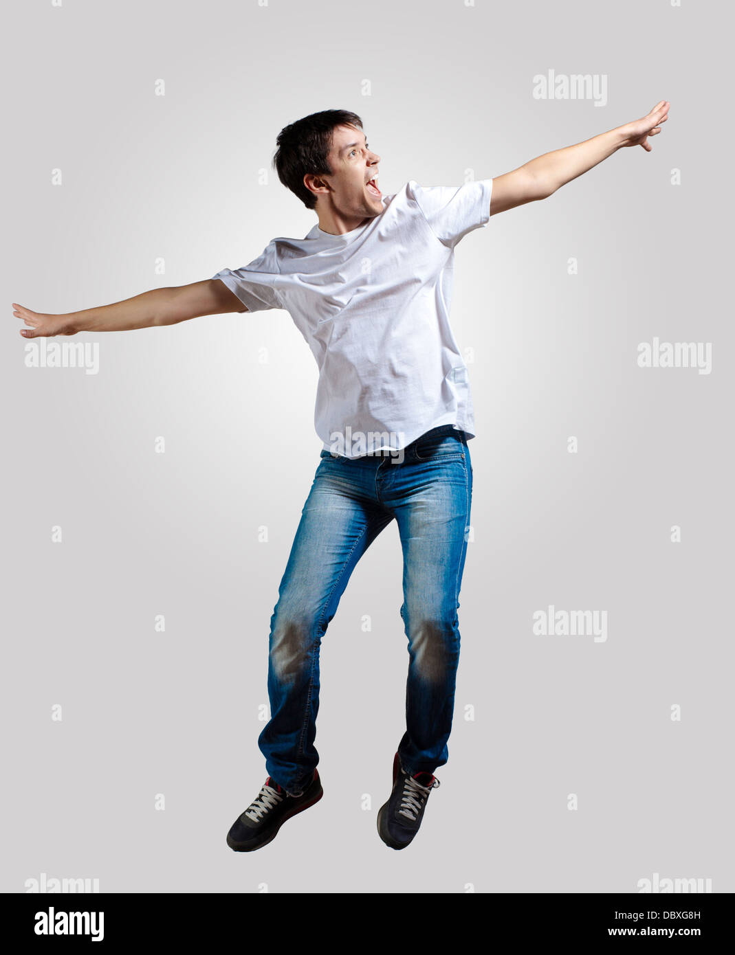 Young man dancing and jumping Stock Photo - Alamy