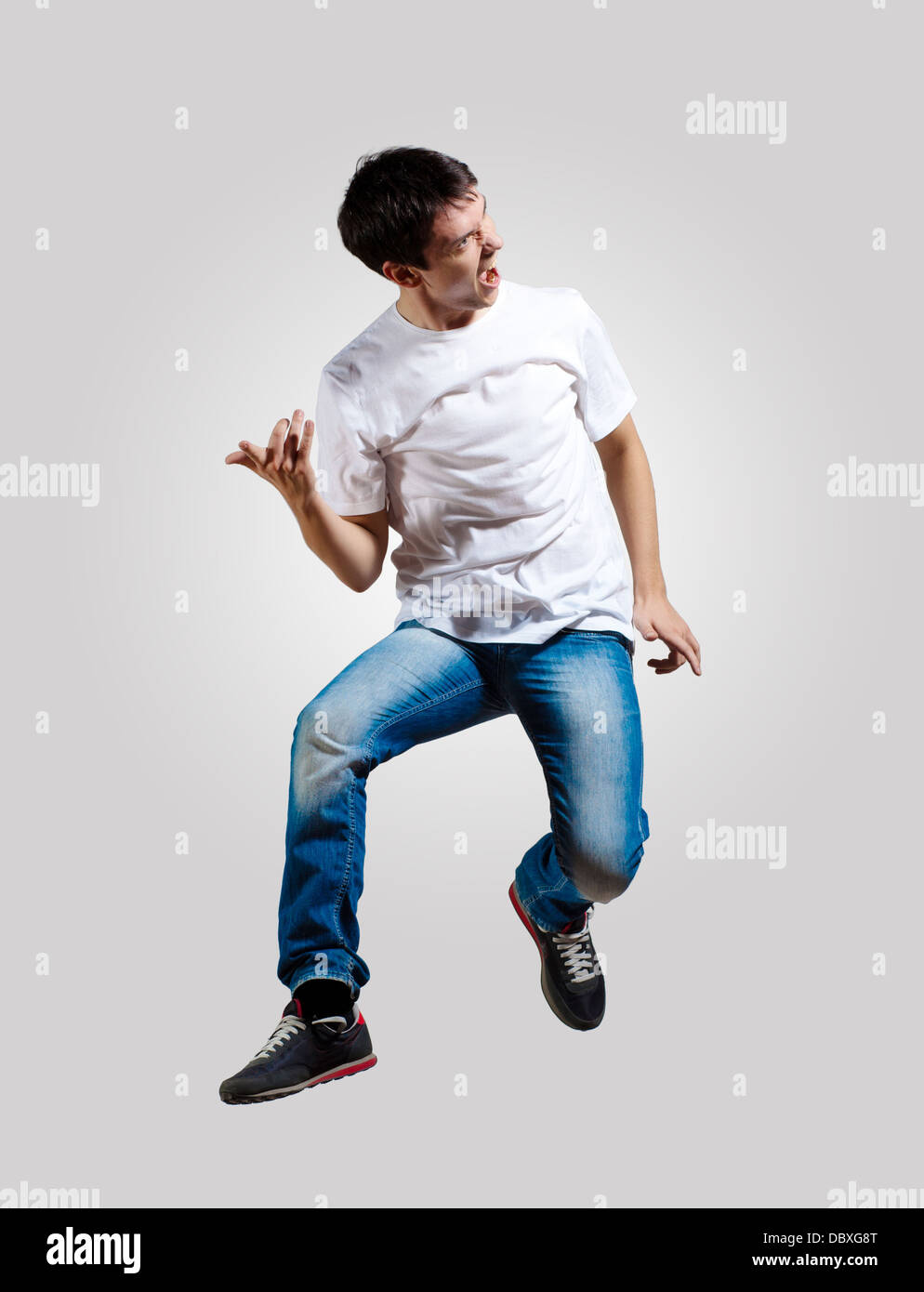 Young man dancing and jumping Stock Photo - Alamy