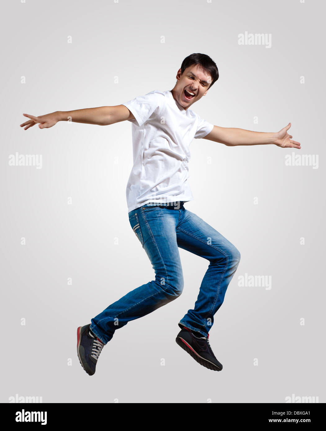 Young man dancing and jumping Stock Photo - Alamy