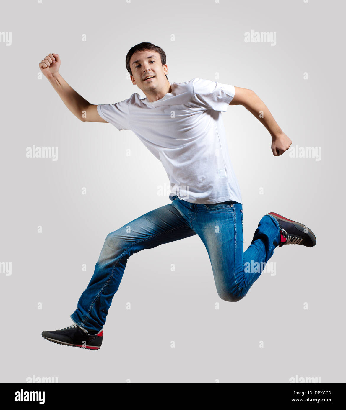 Young man dancing and jumping Stock Photo - Alamy