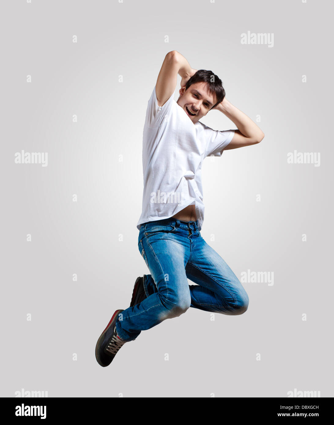 Young man dancing and jumping Stock Photo - Alamy