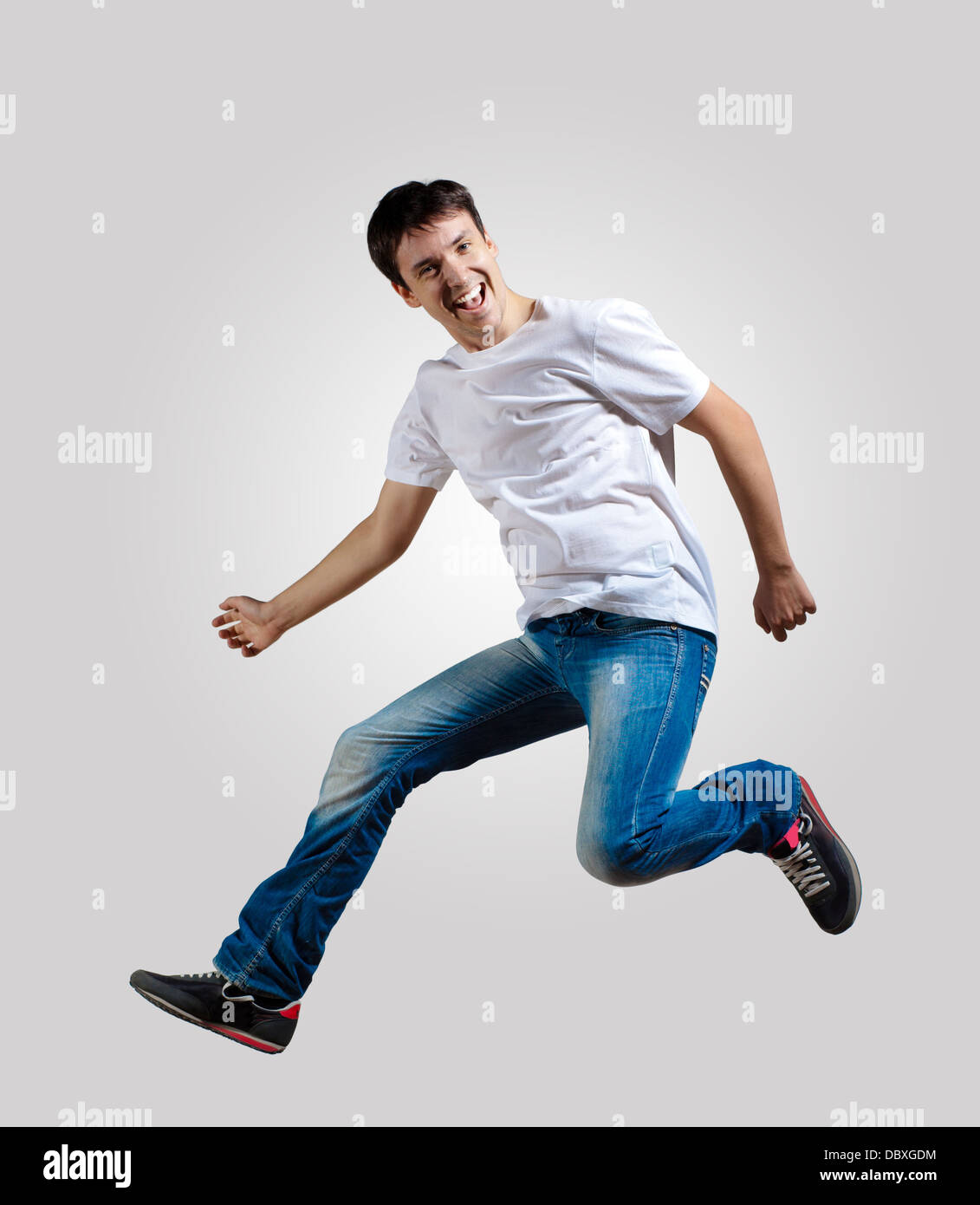 Young man dancing and jumping Stock Photo - Alamy