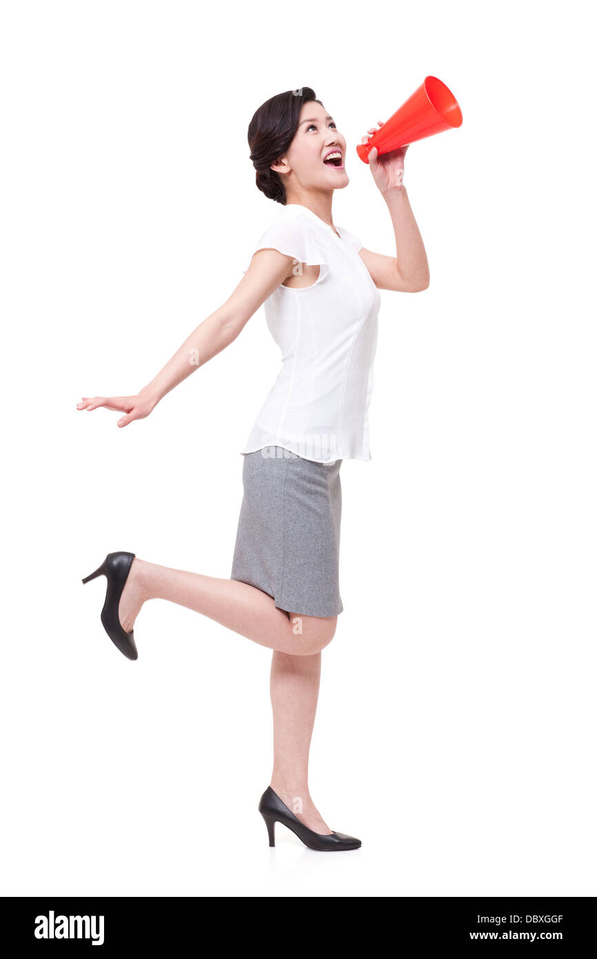 Excited businesswoman shouting with megaphone Stock Photo - Alamy