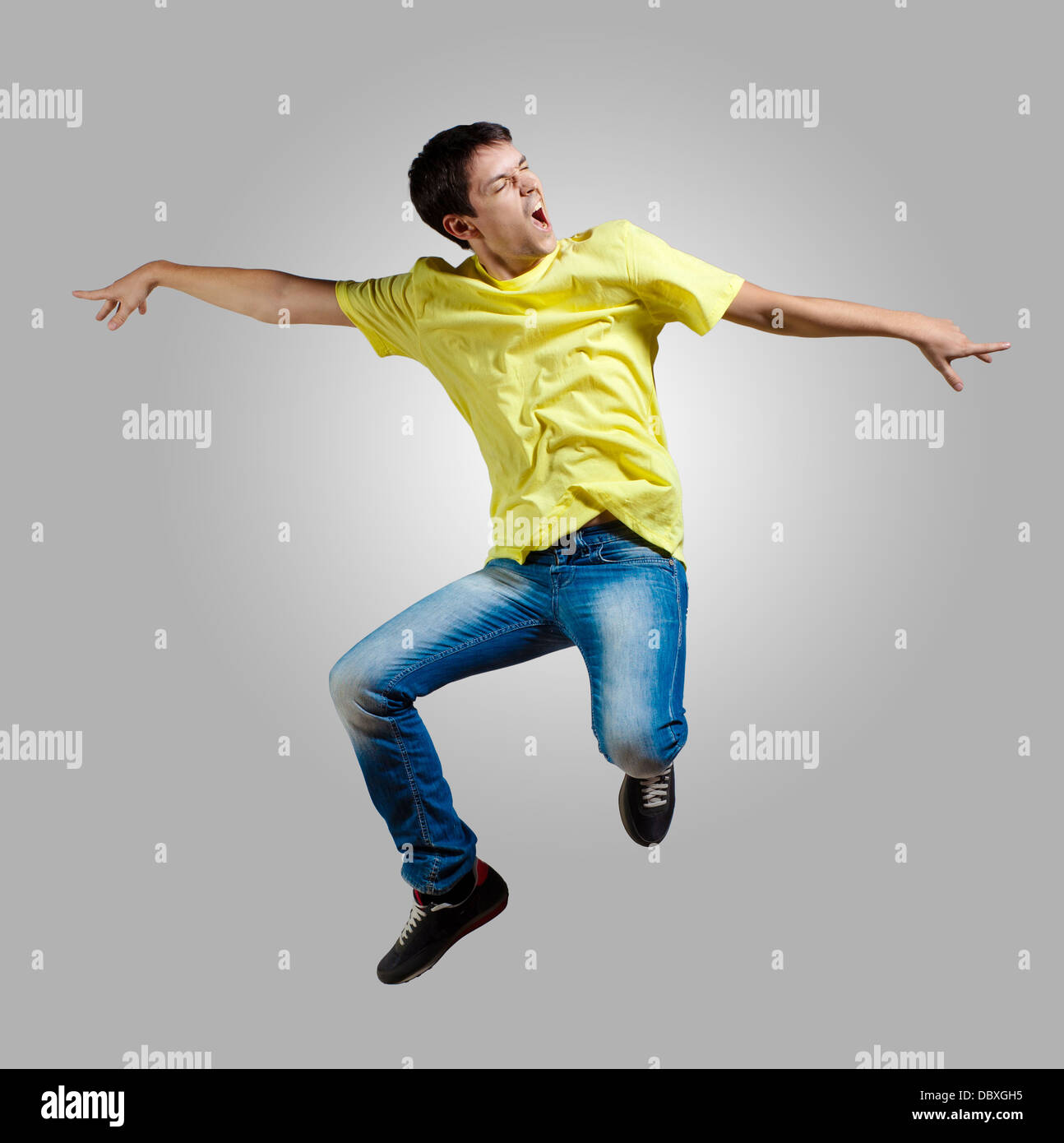 Young man dancing and jumping Stock Photo - Alamy
