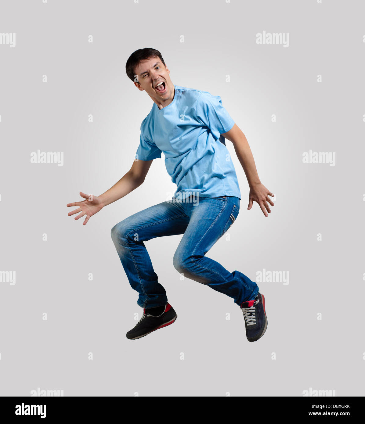 Young man dancing and jumping Stock Photo - Alamy